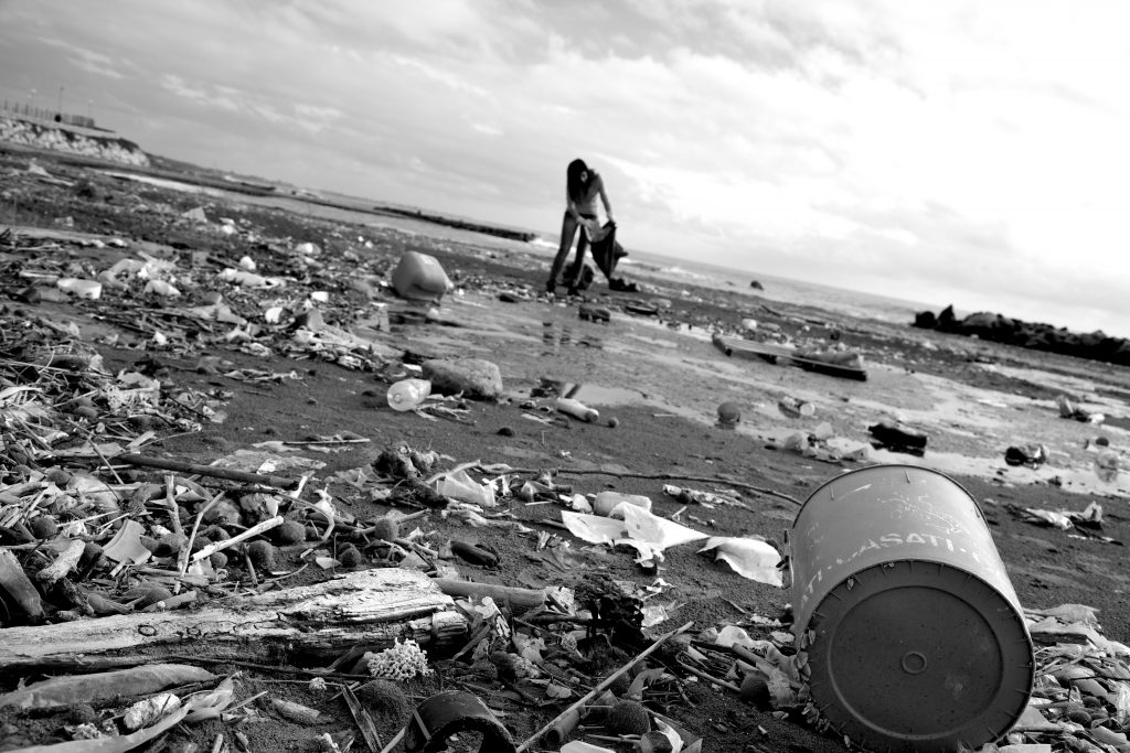 Ecological danger disaster on beach black and white - Genome BC